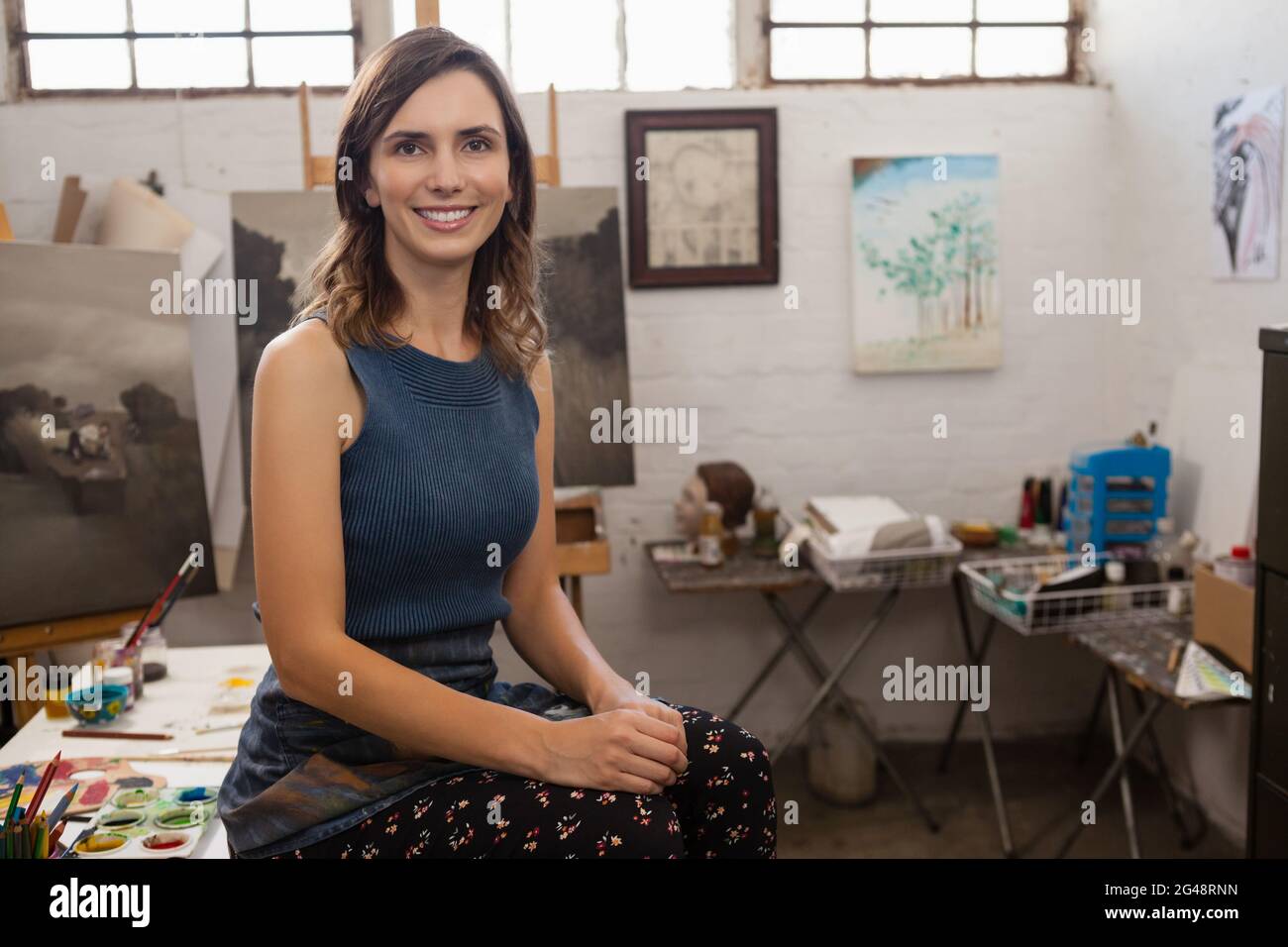 Beautiful woman sitting table drawing hi-res stock photography and ...