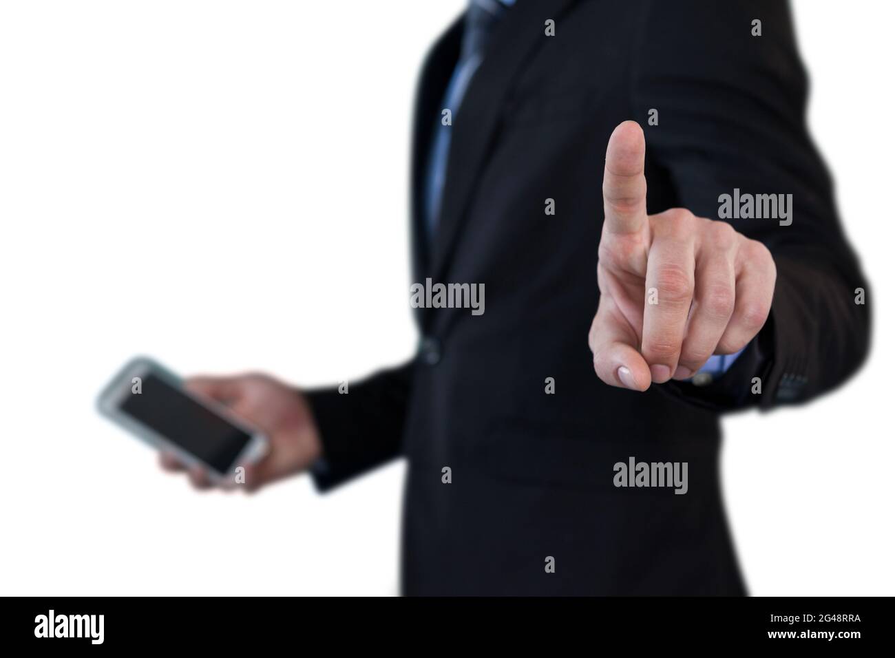 Mid section of businessman holding smartphone while using invisible ...