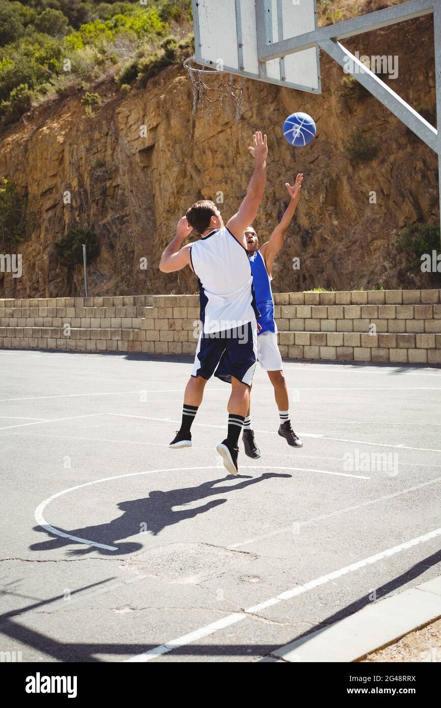 Full length of basketball players practicing in court Stock Photo - Alamy