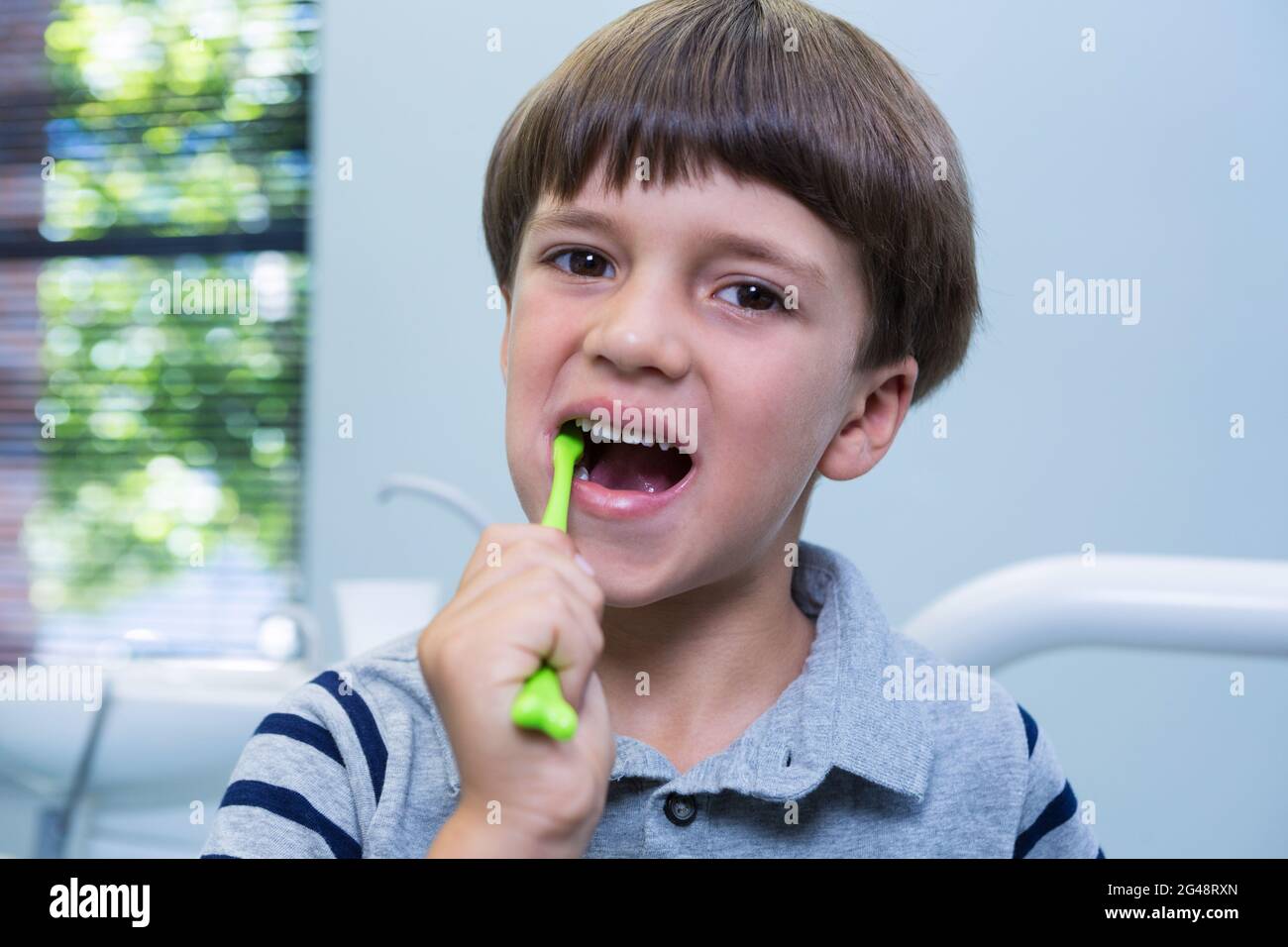 Portrait of boy brushing teeth Stock Photo - Alamy