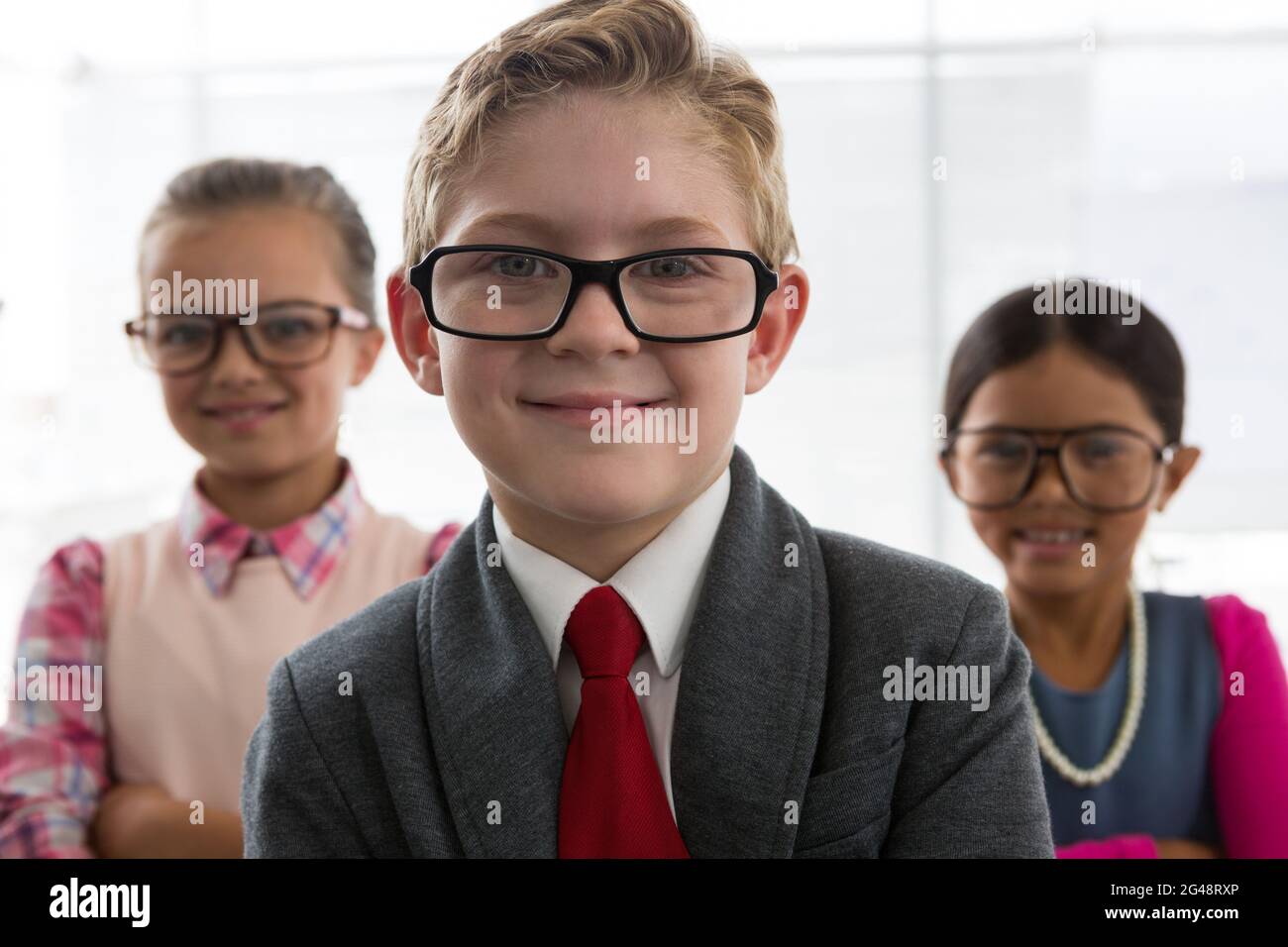 Kids as business executive smiling while standing in the office Stock ...