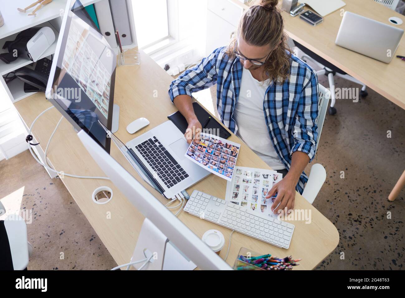 Male executive working over computer hi-res stock photography and ...