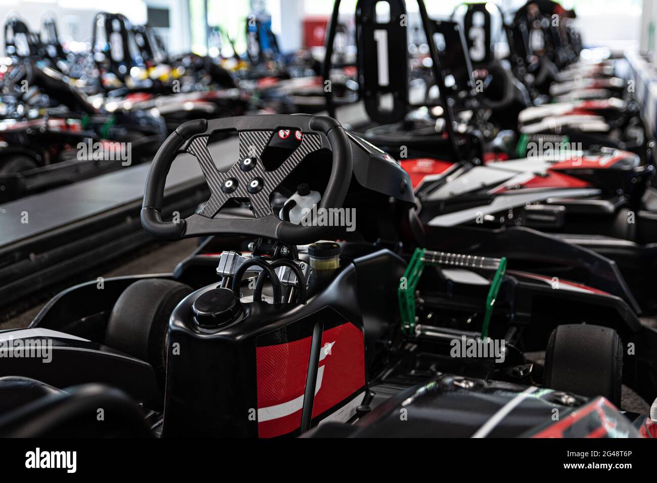 Karting steering wheel on sport moto track Stock Photo - Alamy