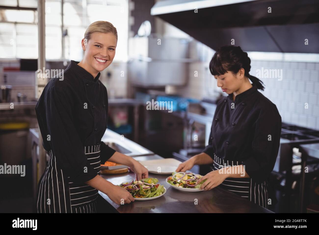 Two pretty female chefs looking hi-res stock photography and images - Alamy