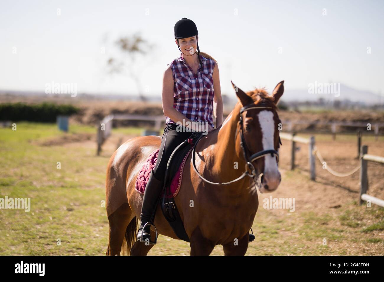 Woman jockey sitting horseback hi-res stock photography and images - Alamy