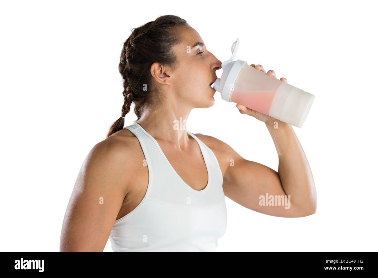 Female athlete drinking energy drink Stock Photo - Alamy