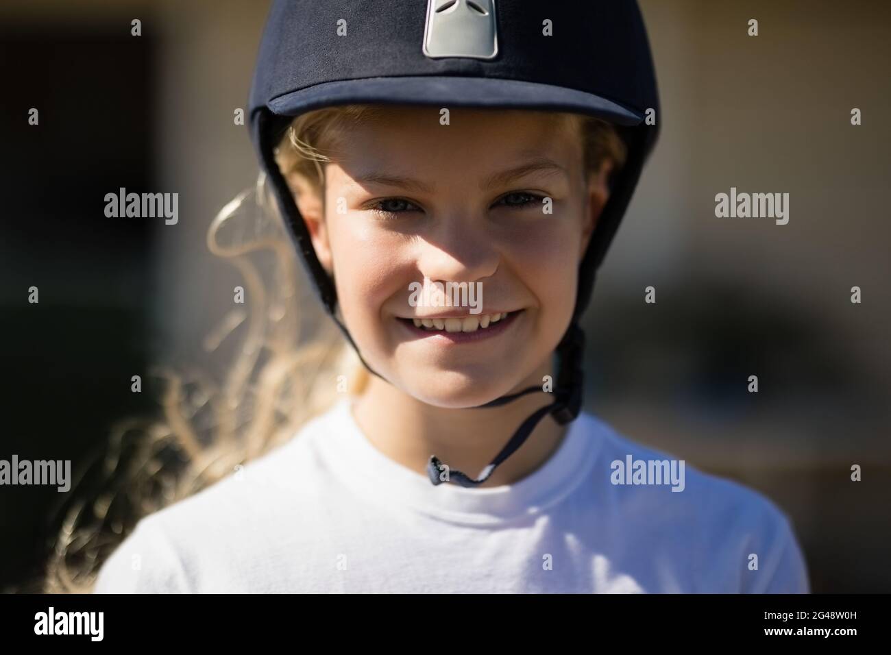 Rider girl smiling in the ranch Stock Photo - Alamy