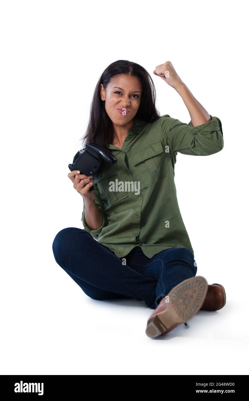 Excited woman playing video games Stock Photo - Alamy