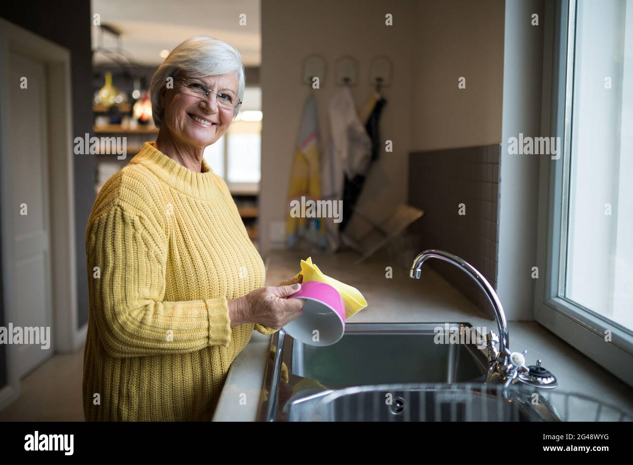 Washing elderly woman pensioner hi-res stock photography and images - Alamy