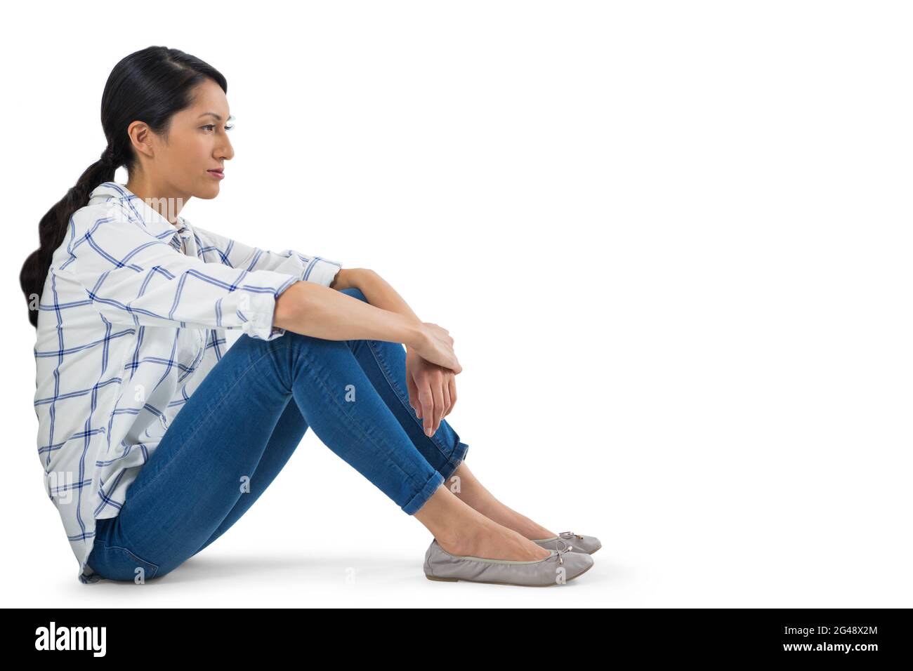 Woman relaxing against white background Stock Photo - Alamy