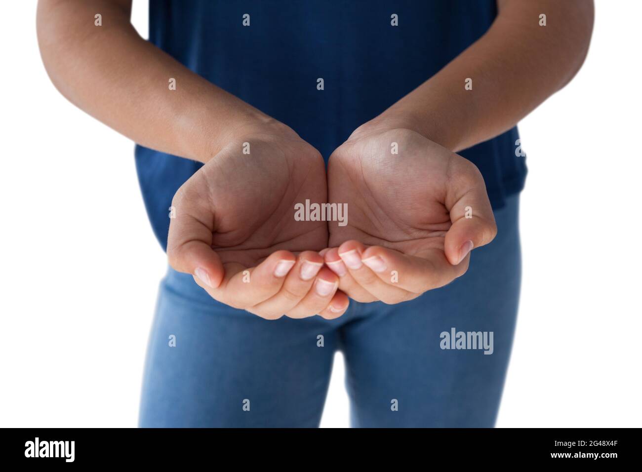 Girl with hand cupped against white background Stock Photo - Alamy