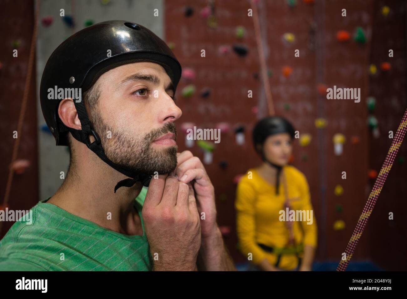 Male athlete wearing sports helmet in health club Stock Photo - Alamy