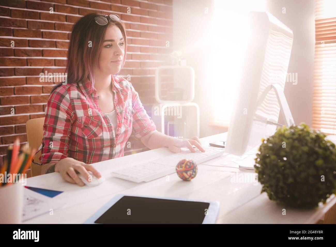 Executive using desktop computer in office Stock Photo - Alamy