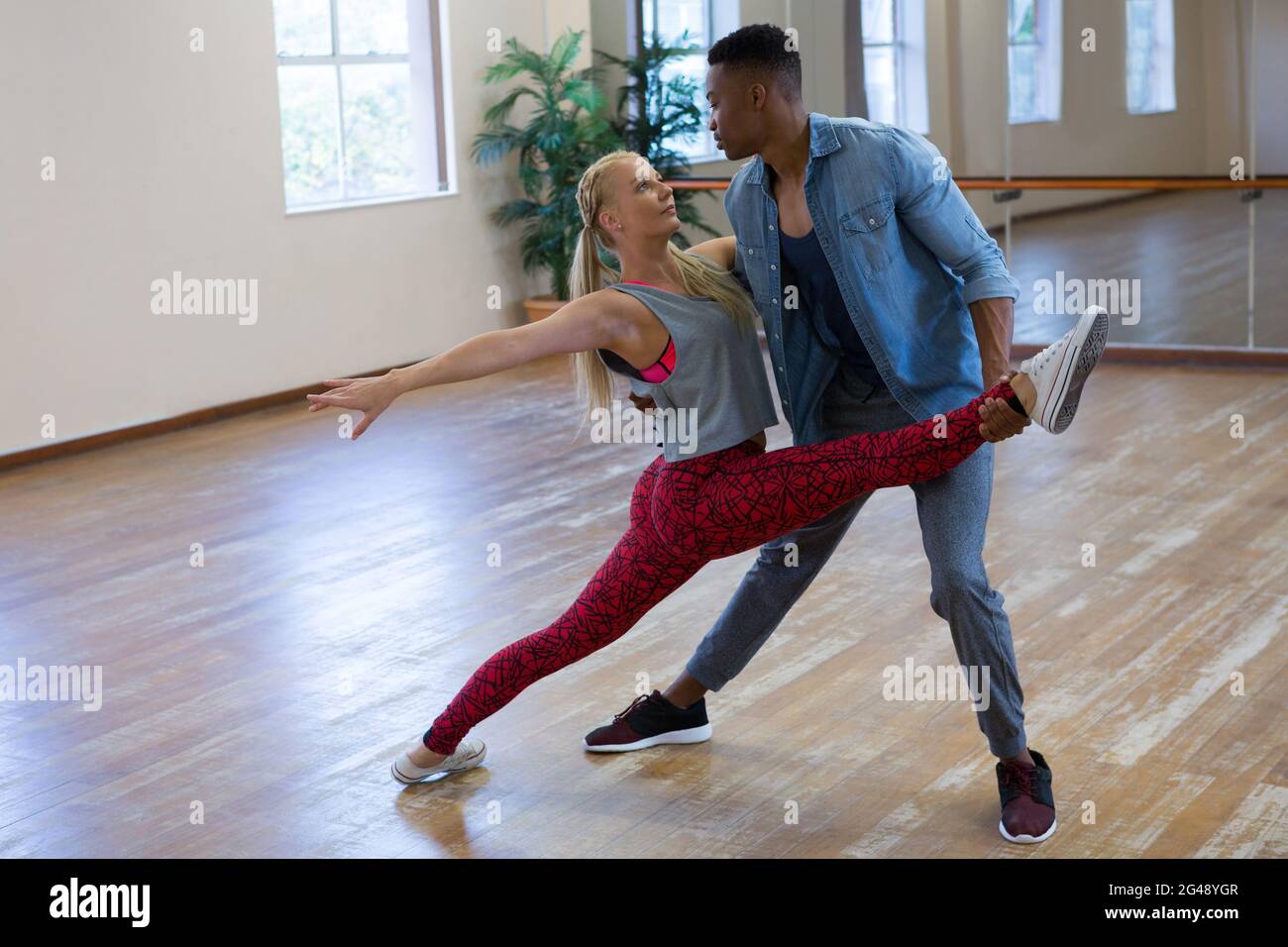 Male dancer stretching arm hi-res stock photography and images - Alamy