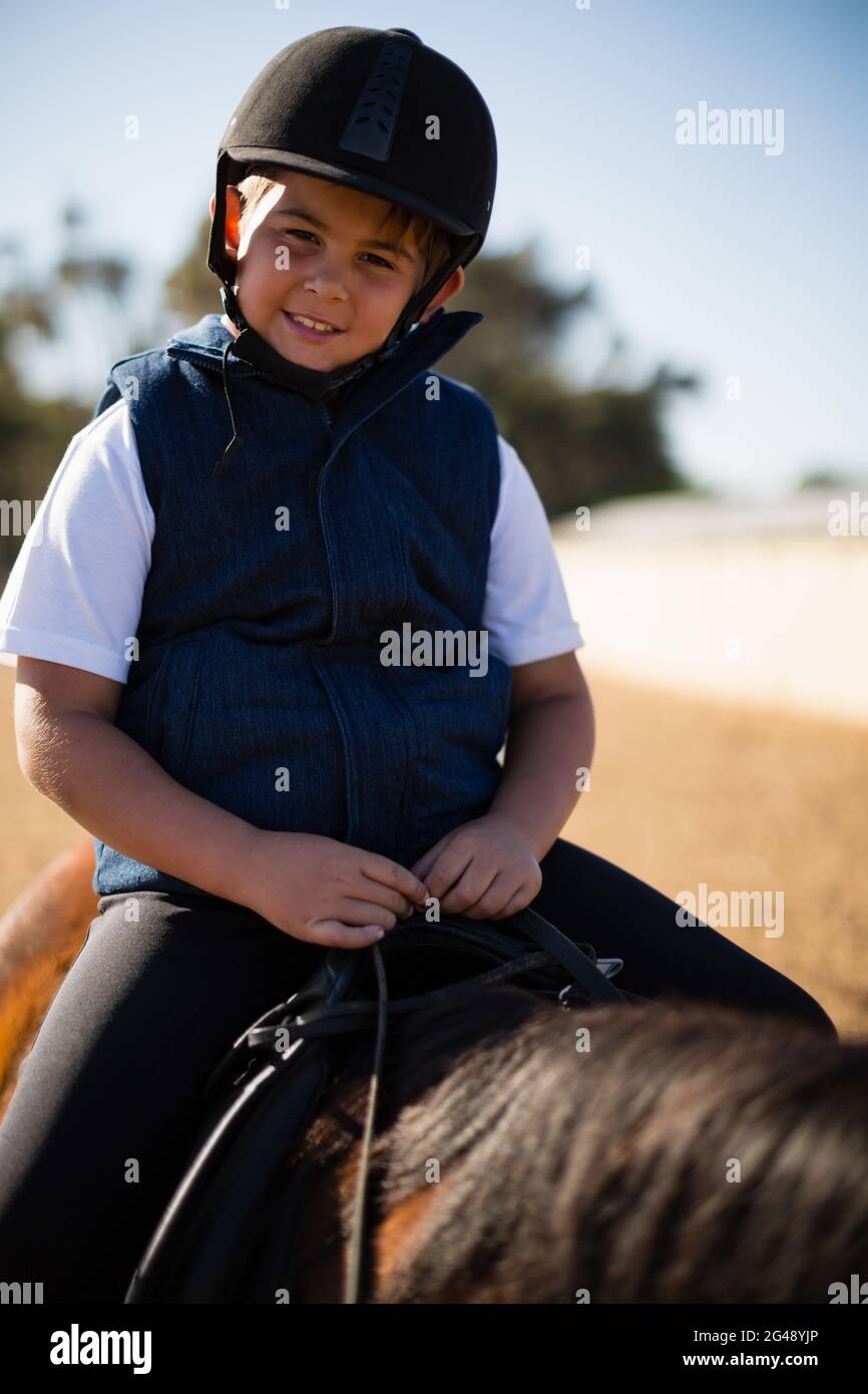 Happy boy riding pony horse hi-res stock photography and images - Alamy