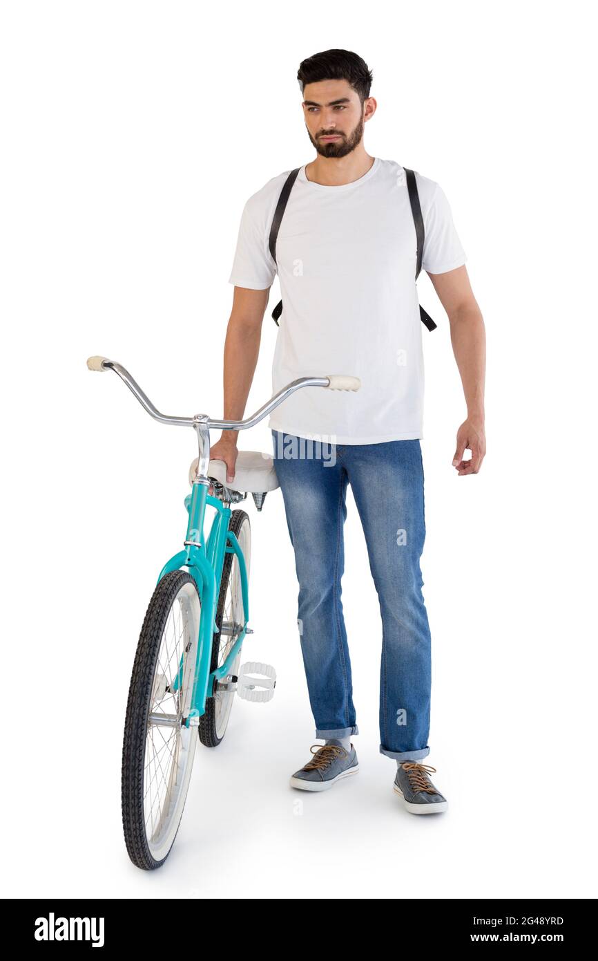 Man posing with bicycle against white background Stock Photo - Alamy