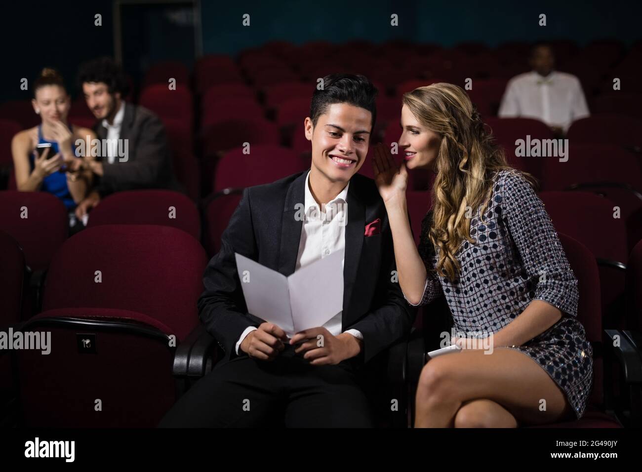 Man whispering in cinema hi-res stock photography and images - Alamy