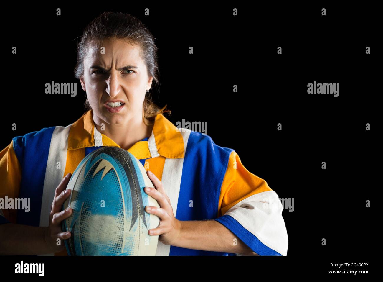 Portrait of aggressive female rugby player Stock Photo - Alamy