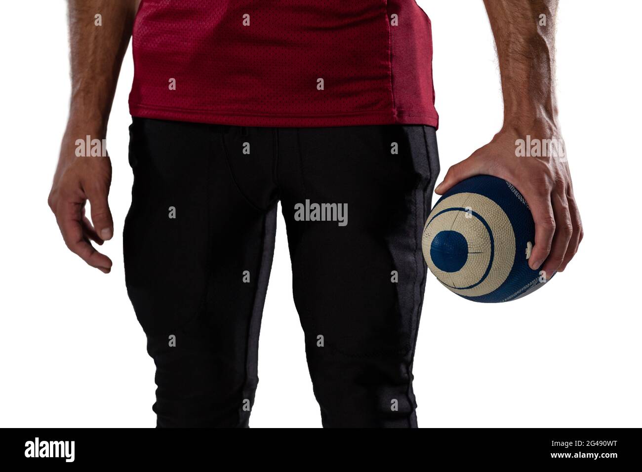 Midsection of sportsperson holding ball Stock Photo - Alamy