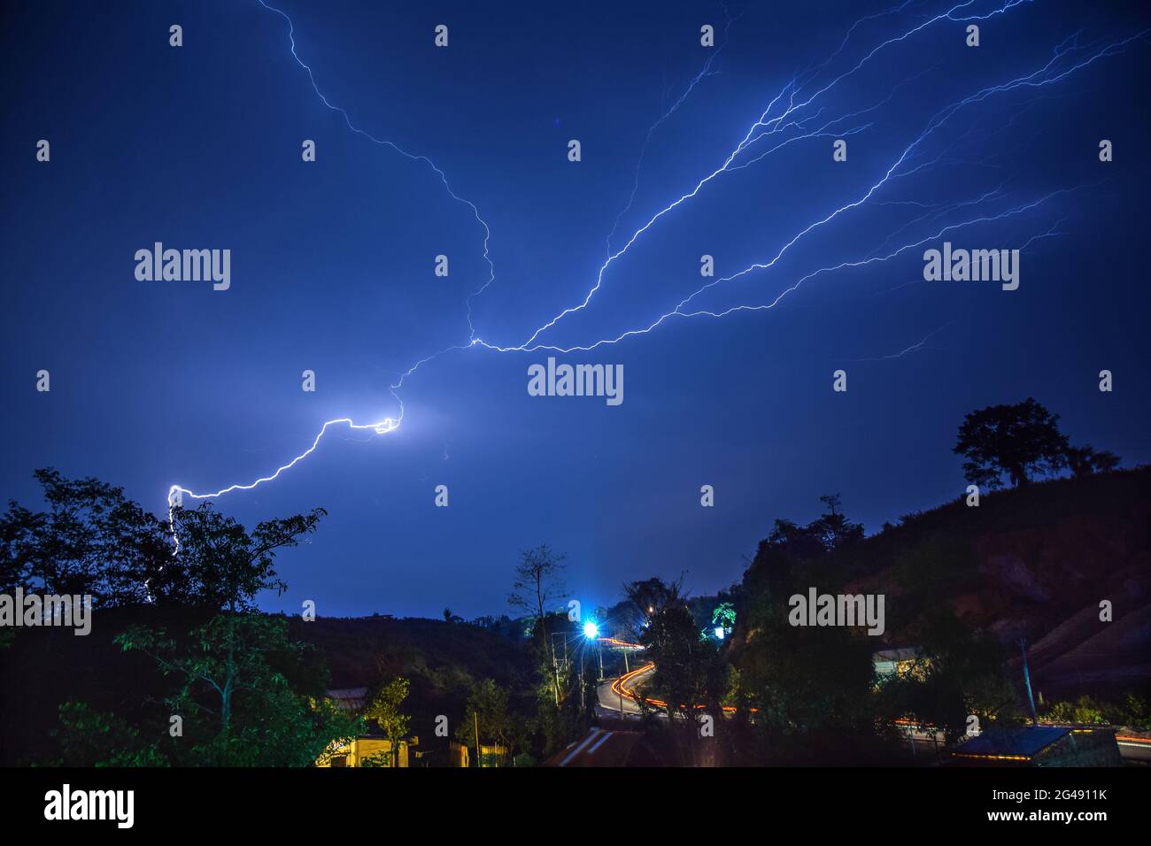 Large lightning bolt in a blue night sky Stock Photo - Alamy