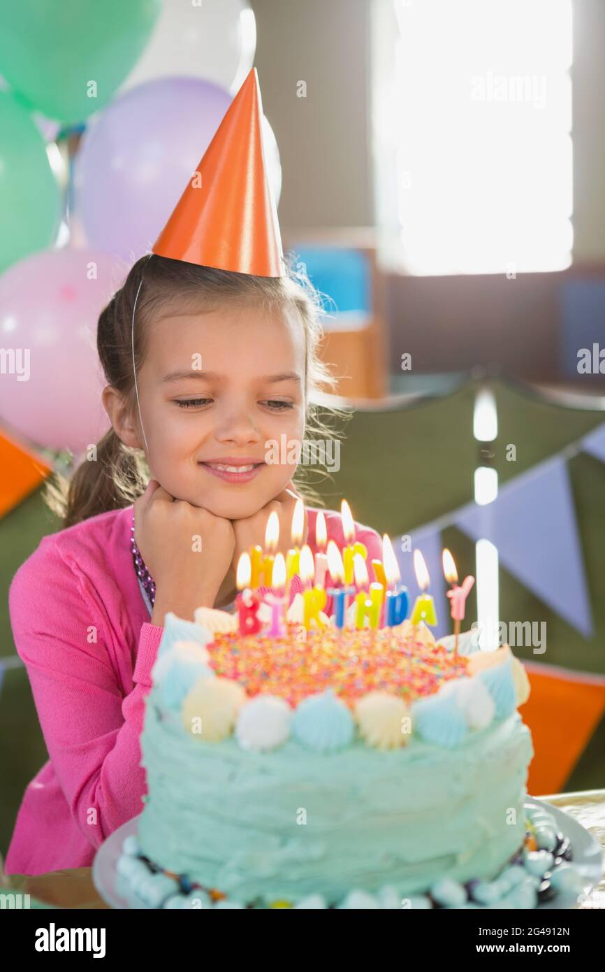 Adorable girl looking birthday hi-res stock photography and images - Alamy