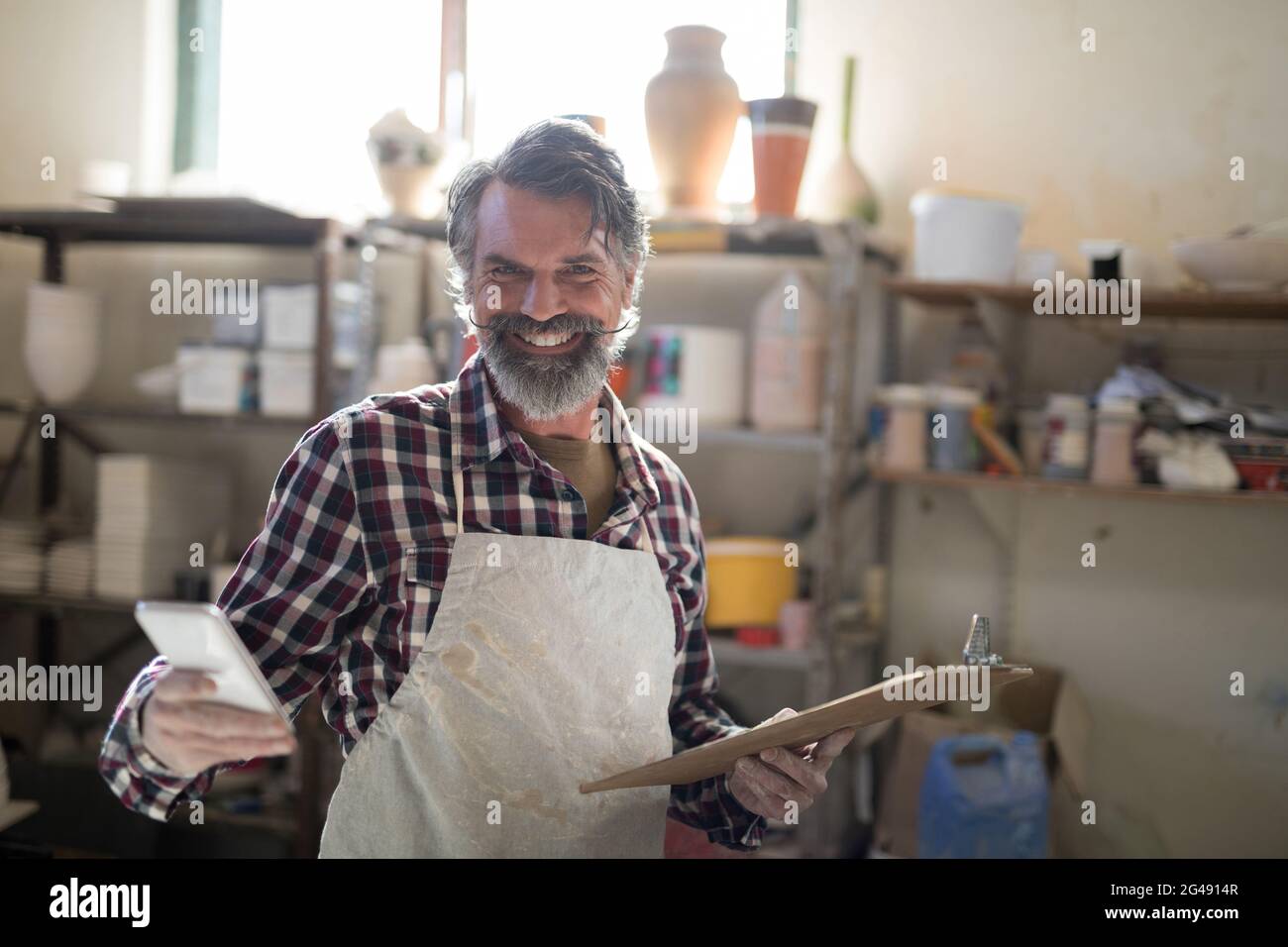 Happy potter hi-res stock photography and images - Alamy