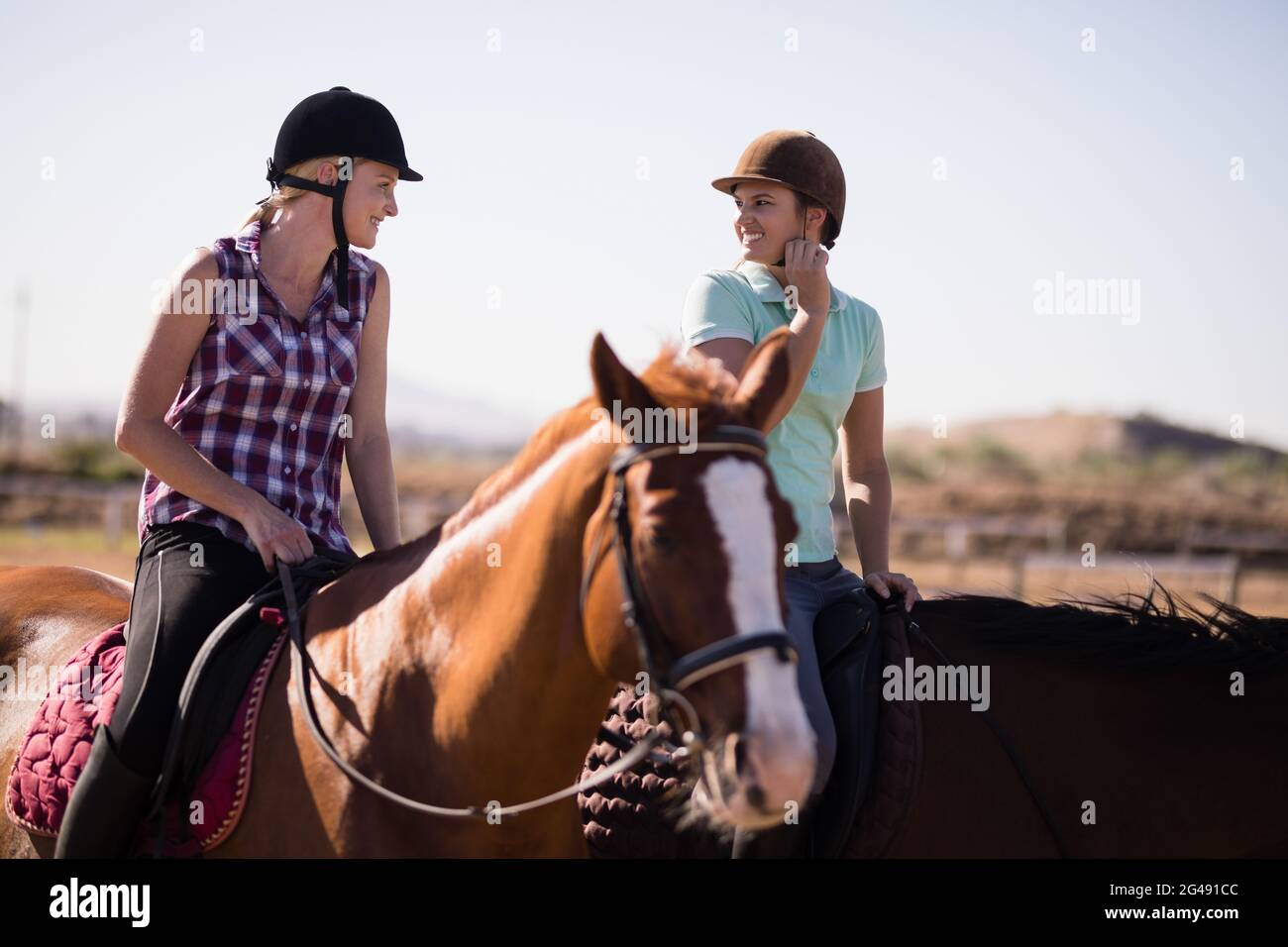Woman jockey sitting horseback hi-res stock photography and images - Alamy