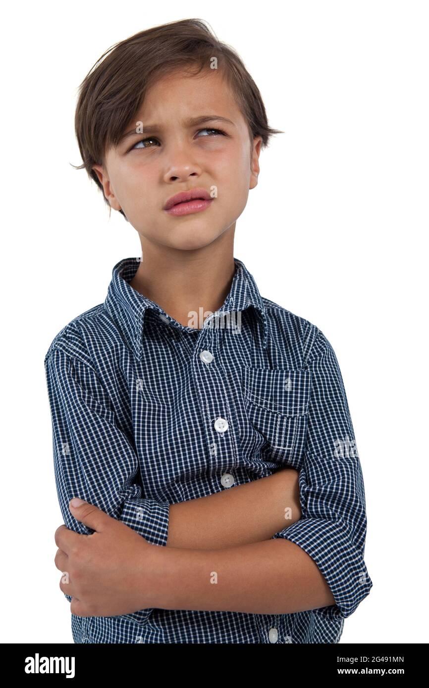 Boy standing against white background Stock Photo - Alamy