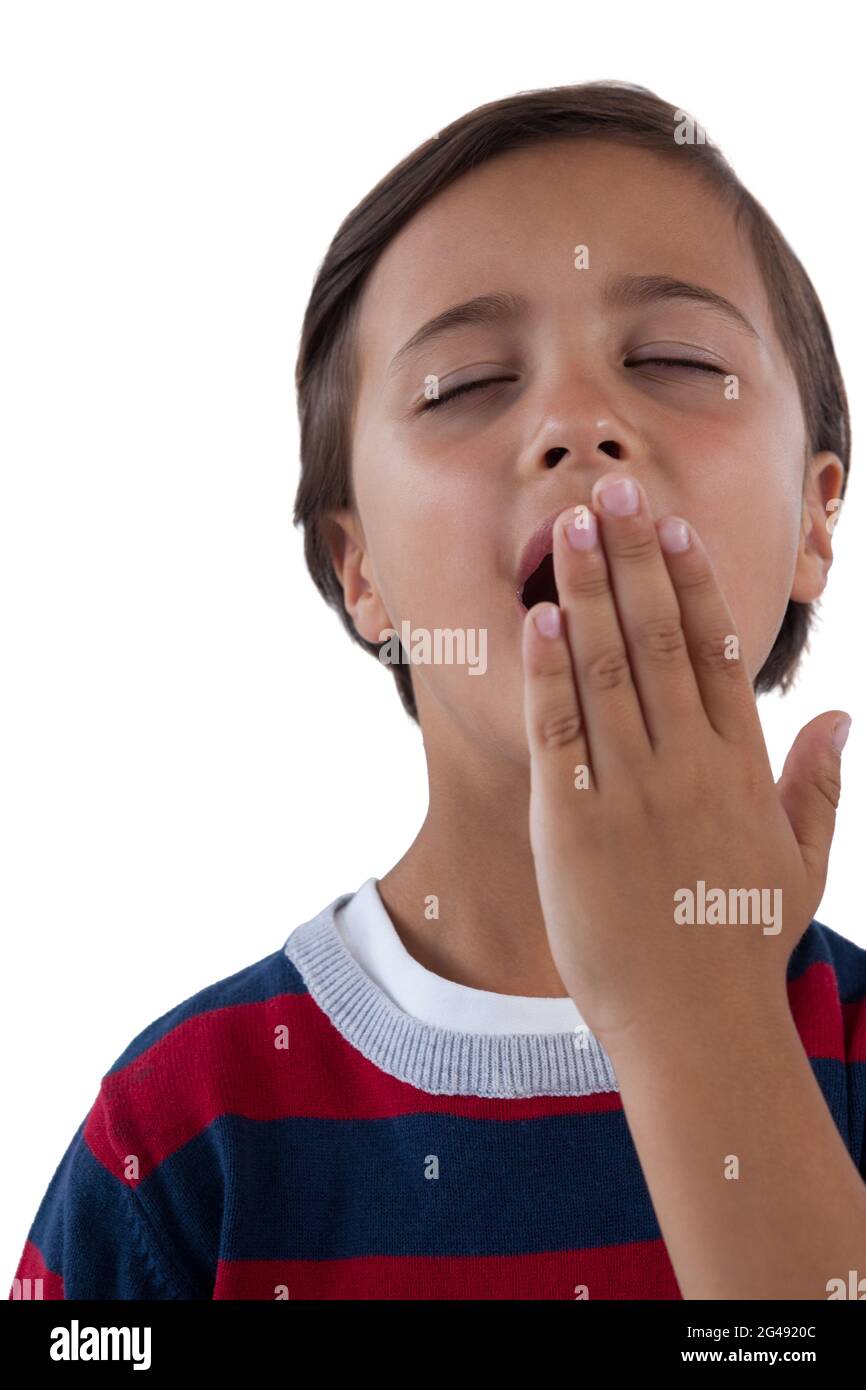 Cute boy yawning Stock Photo - Alamy