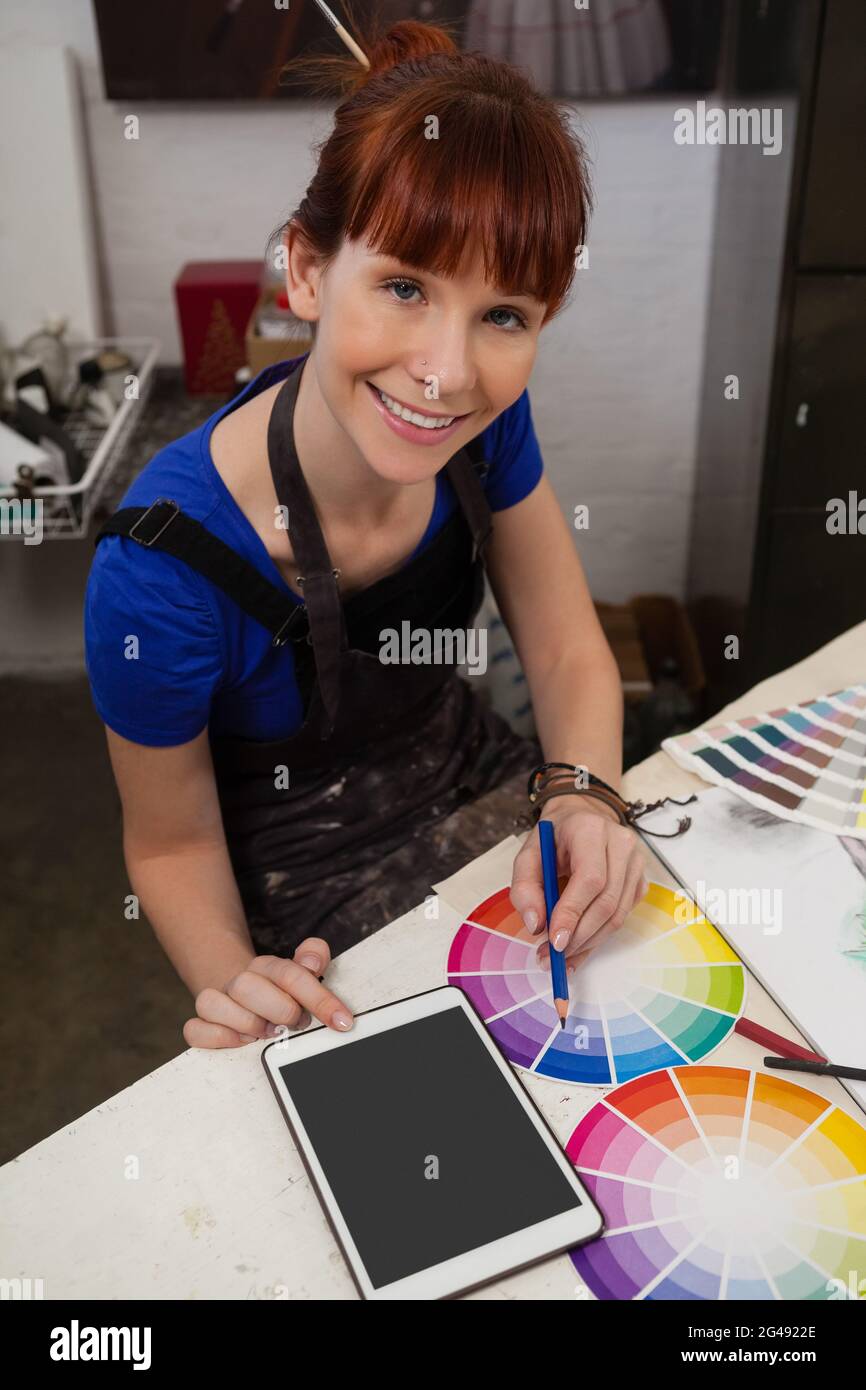 Portrait of beautiful woman matching color with color swatch Stock ...