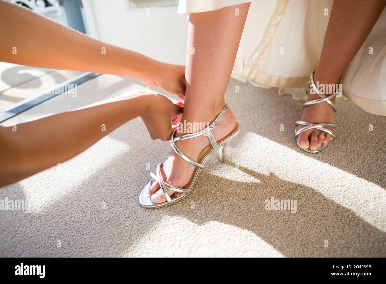 Putting on sandals hi-res stock photography and images - Alamy