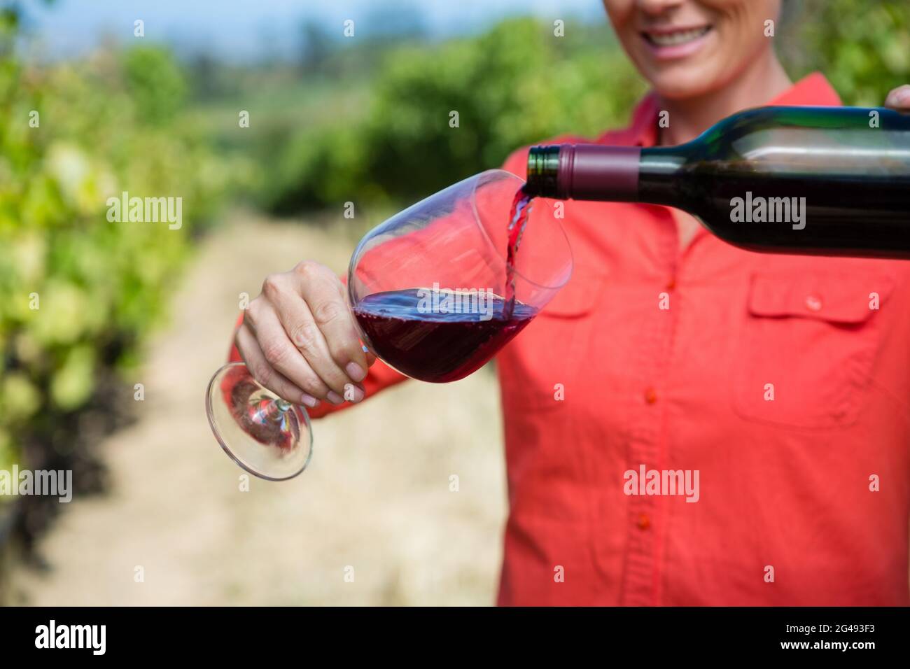 Happy female winemaker smiling in hi-res stock photography and images ...