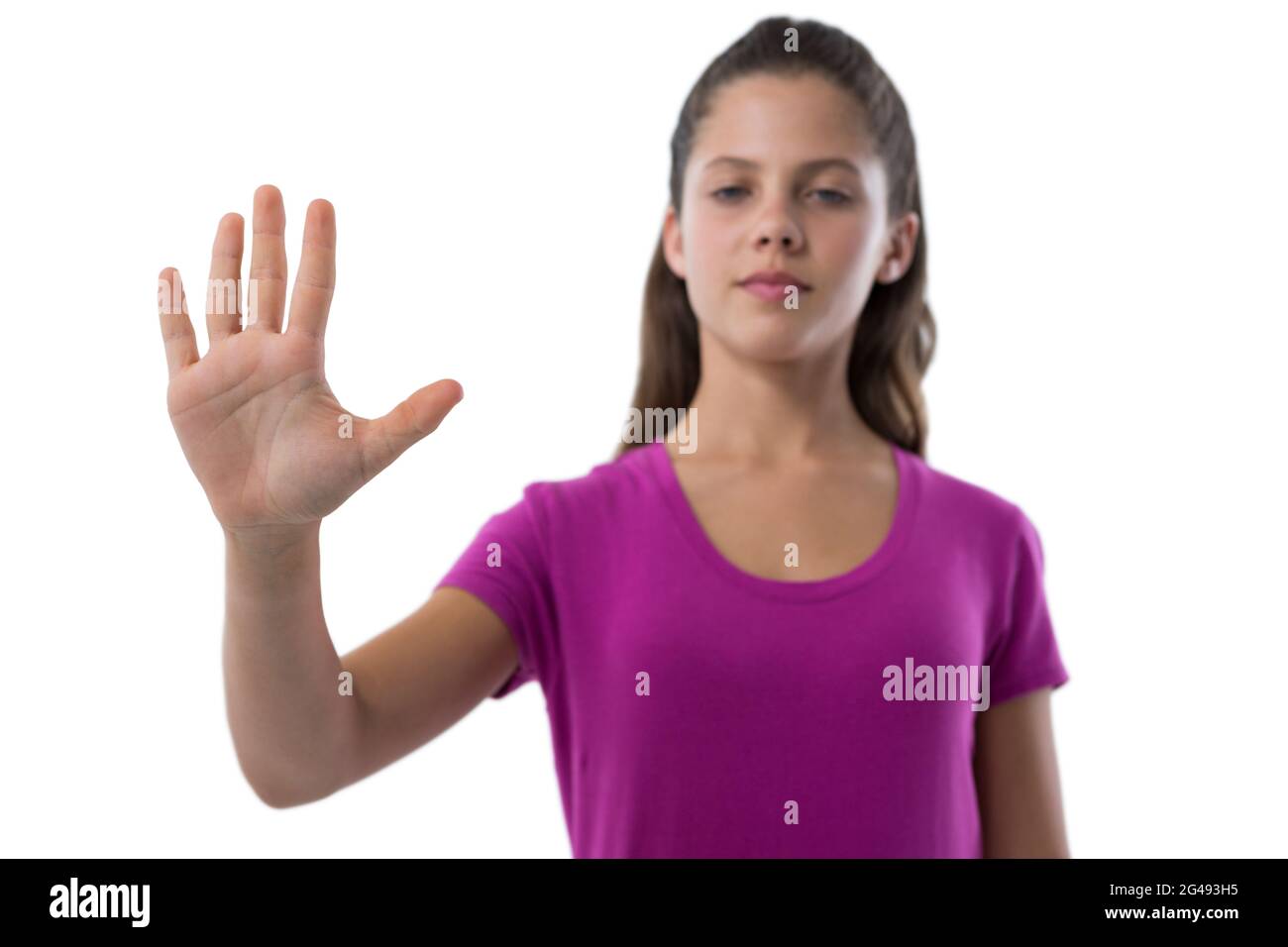 Teenage girl showing stop sign Stock Photo - Alamy