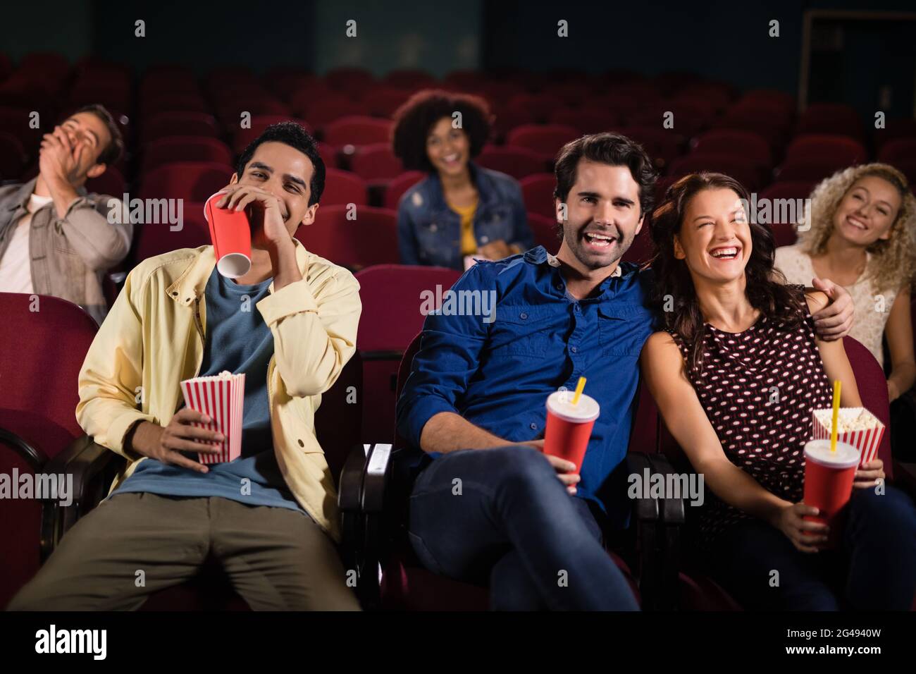 Friends watching movie Stock Photo - Alamy
