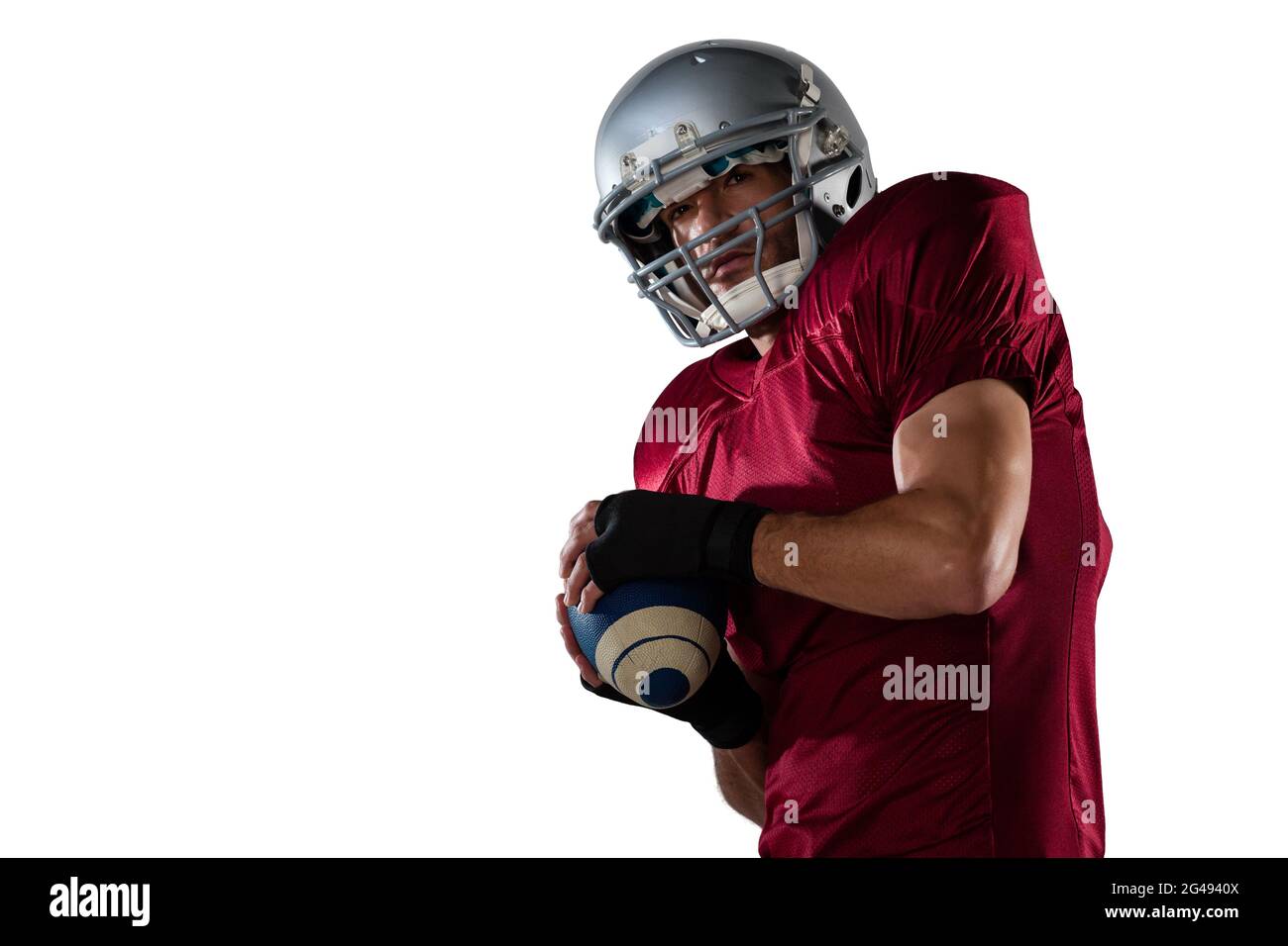 Sportsman wearing helmet while playing American football Stock Photo ...