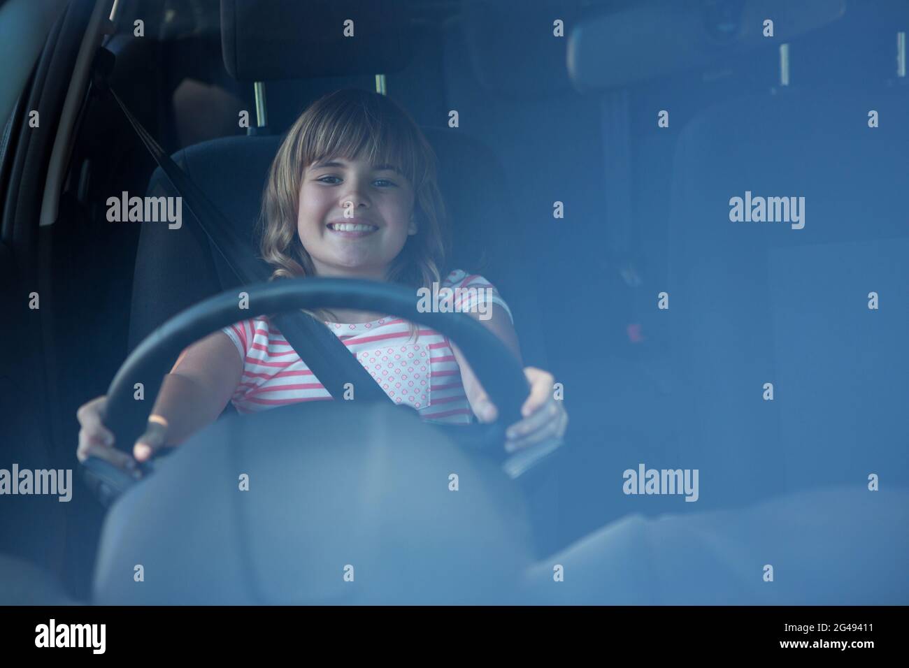 Happy Teenage Girl Driving A Car Stock Photo Alamy