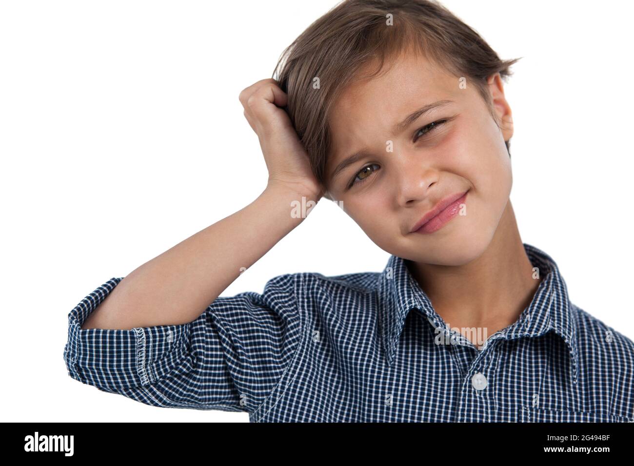 Cute boy standing against white background Stock Photo - Alamy