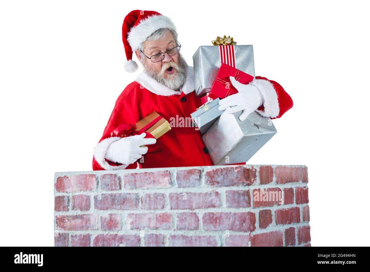 Santa claus placing gift box into a chimney Stock Photo - Alamy