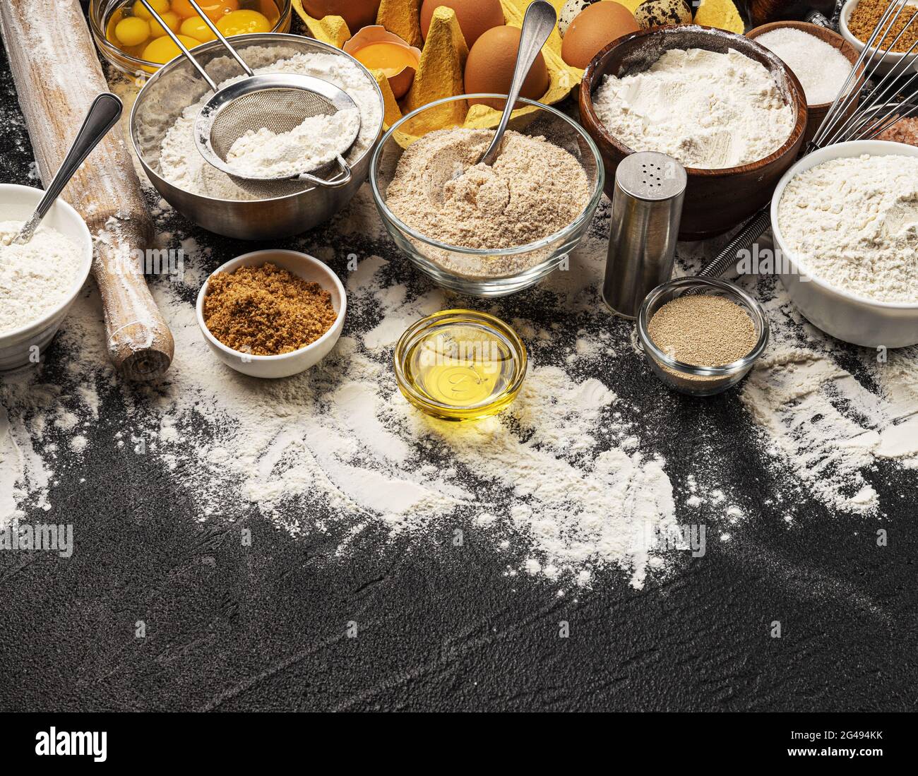 Baking ingredients on black background with copy space Stock Photo - Alamy