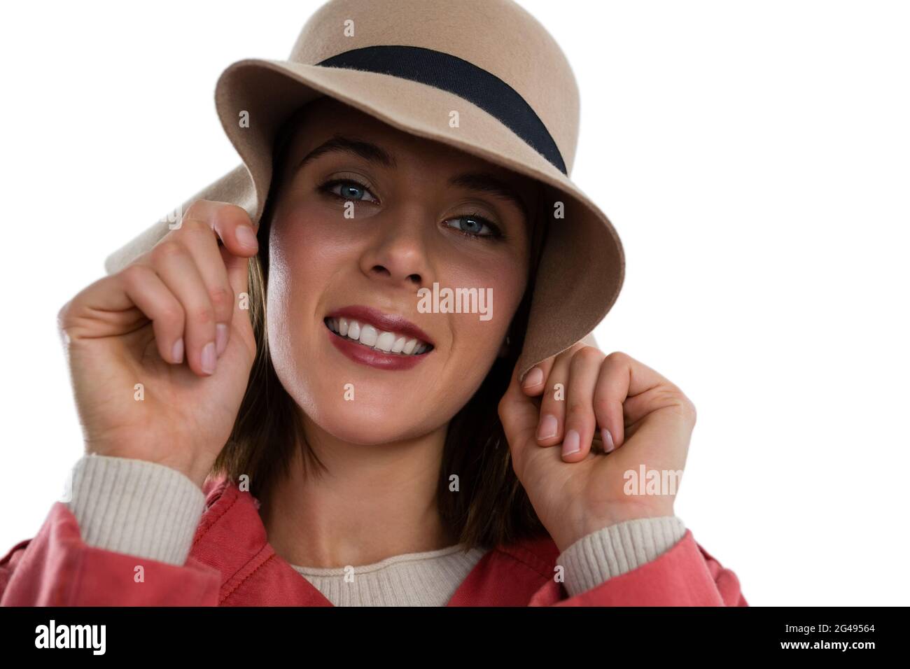 Close up portrait of young woman holding hat Stock Photo - Alamy