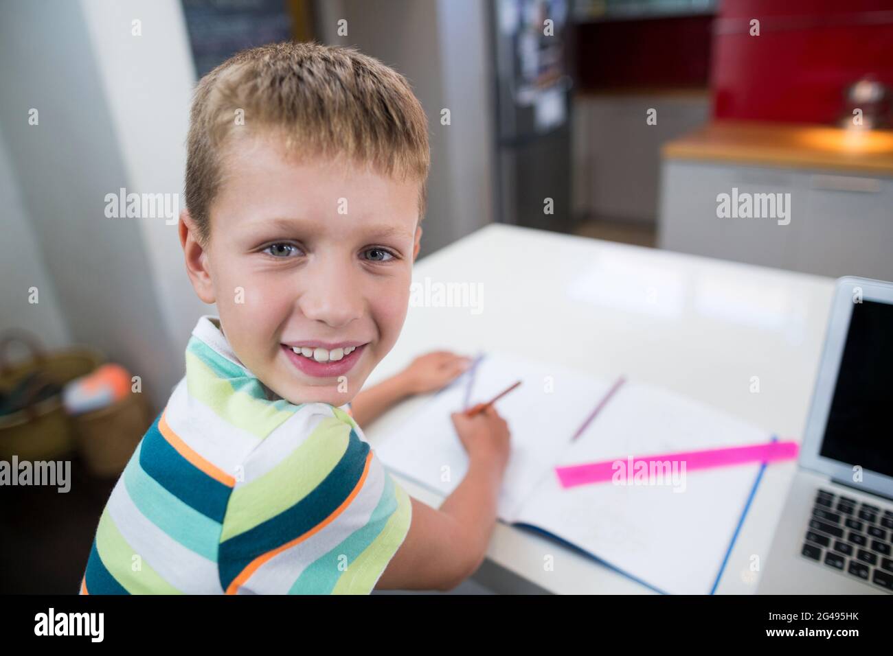 Happy siblings doing homework hi-res stock photography and images - Alamy
