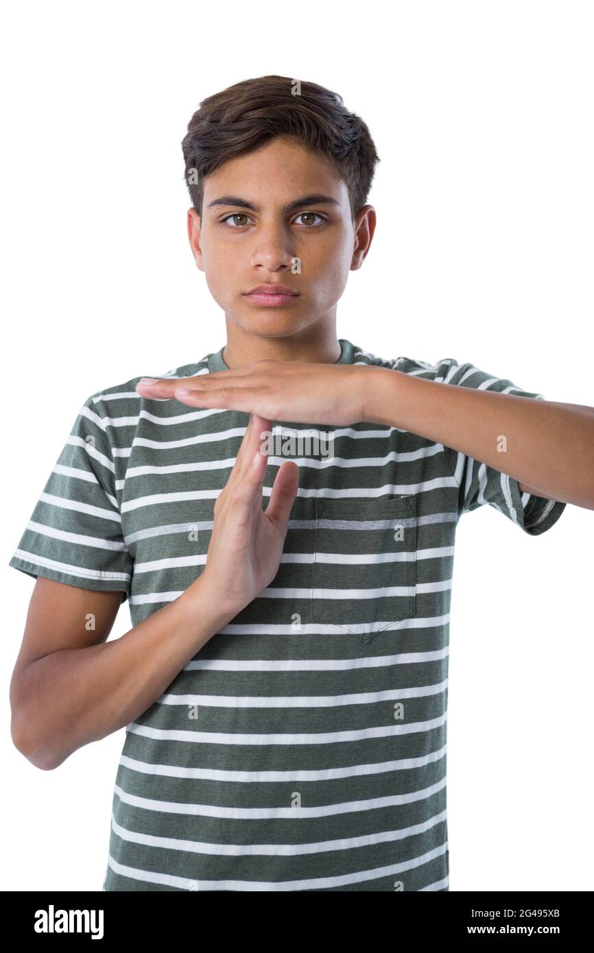 Boy making a timeout hand gesture Stock Photo - Alamy