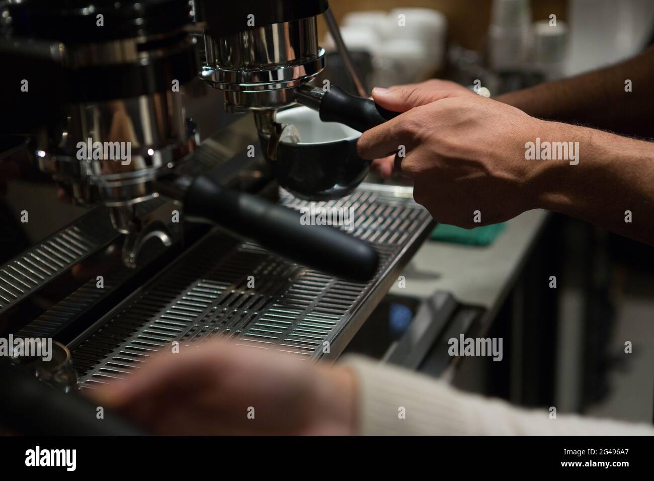 Waiter and waitress working at counter Stock Photo - Alamy