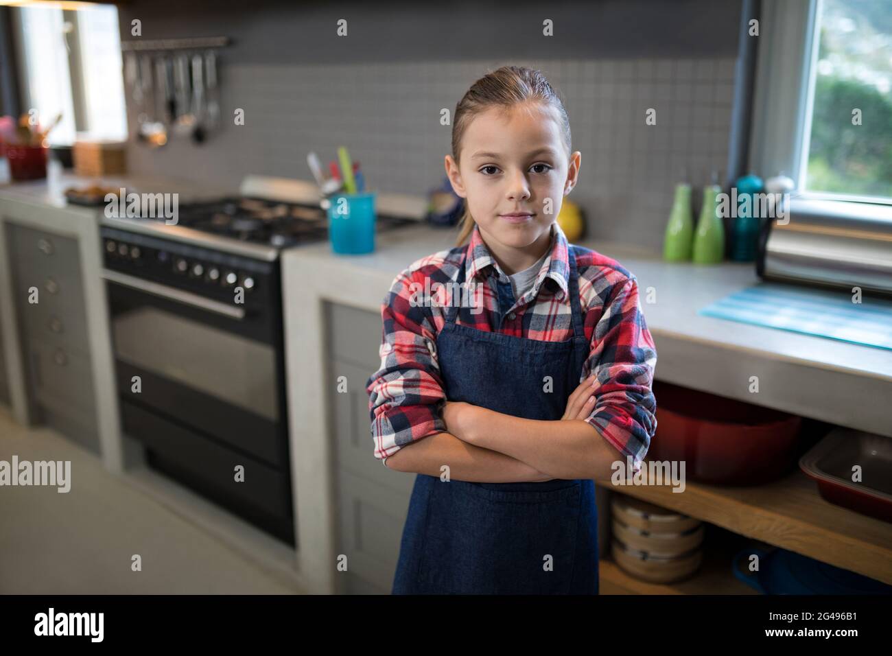 Girl wearing apron in kitchen hi-res stock photography and images - Alamy