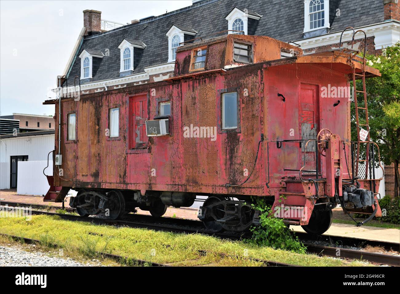 Old red dilapidated caboose Stock Photo - Alamy