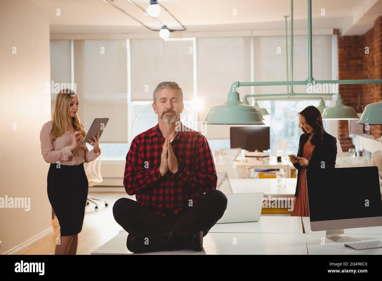 Asian woman meditating in computer hi-res stock photography and images ...