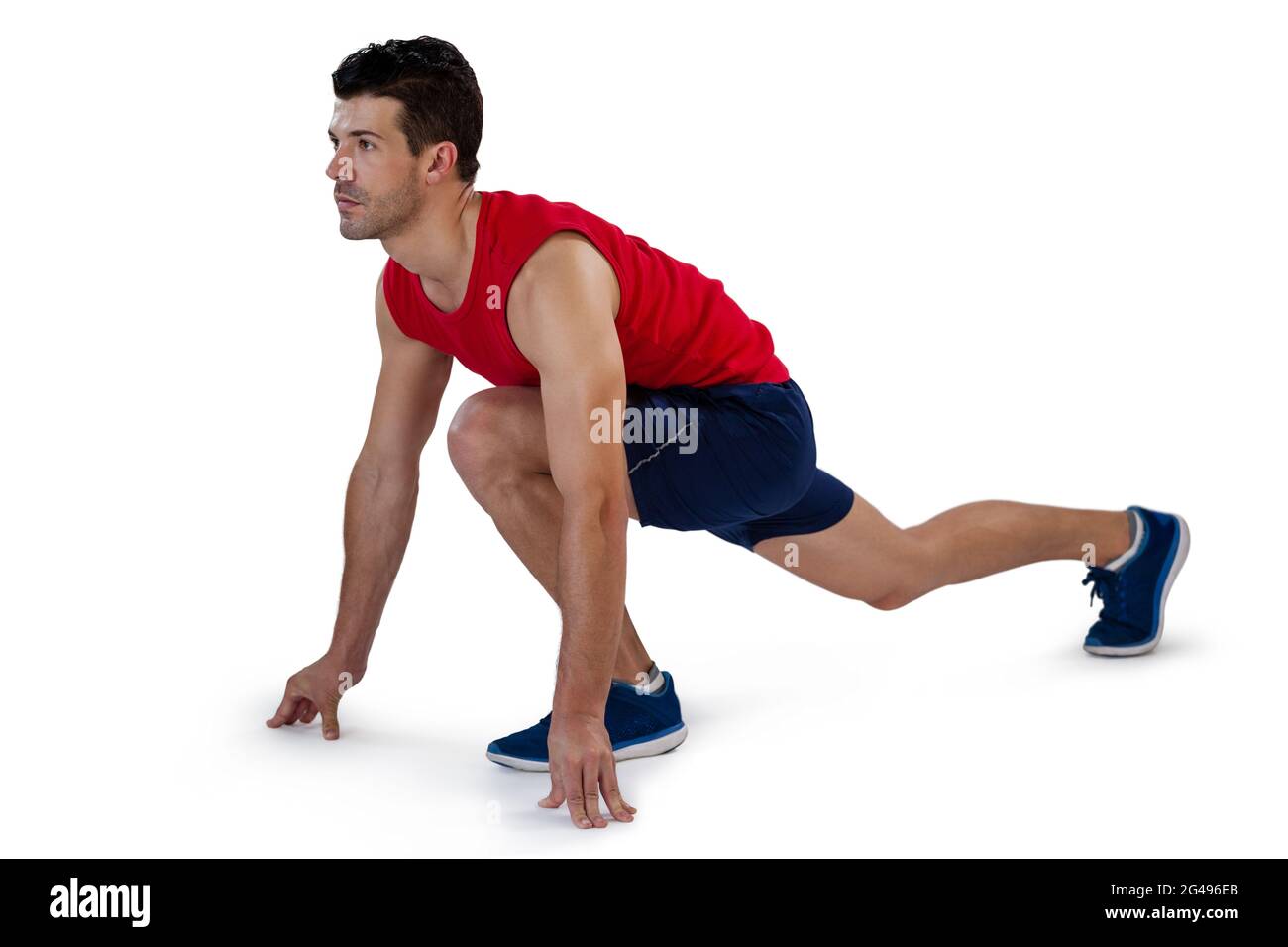 Concentrated sports player in running position Stock Photo - Alamy