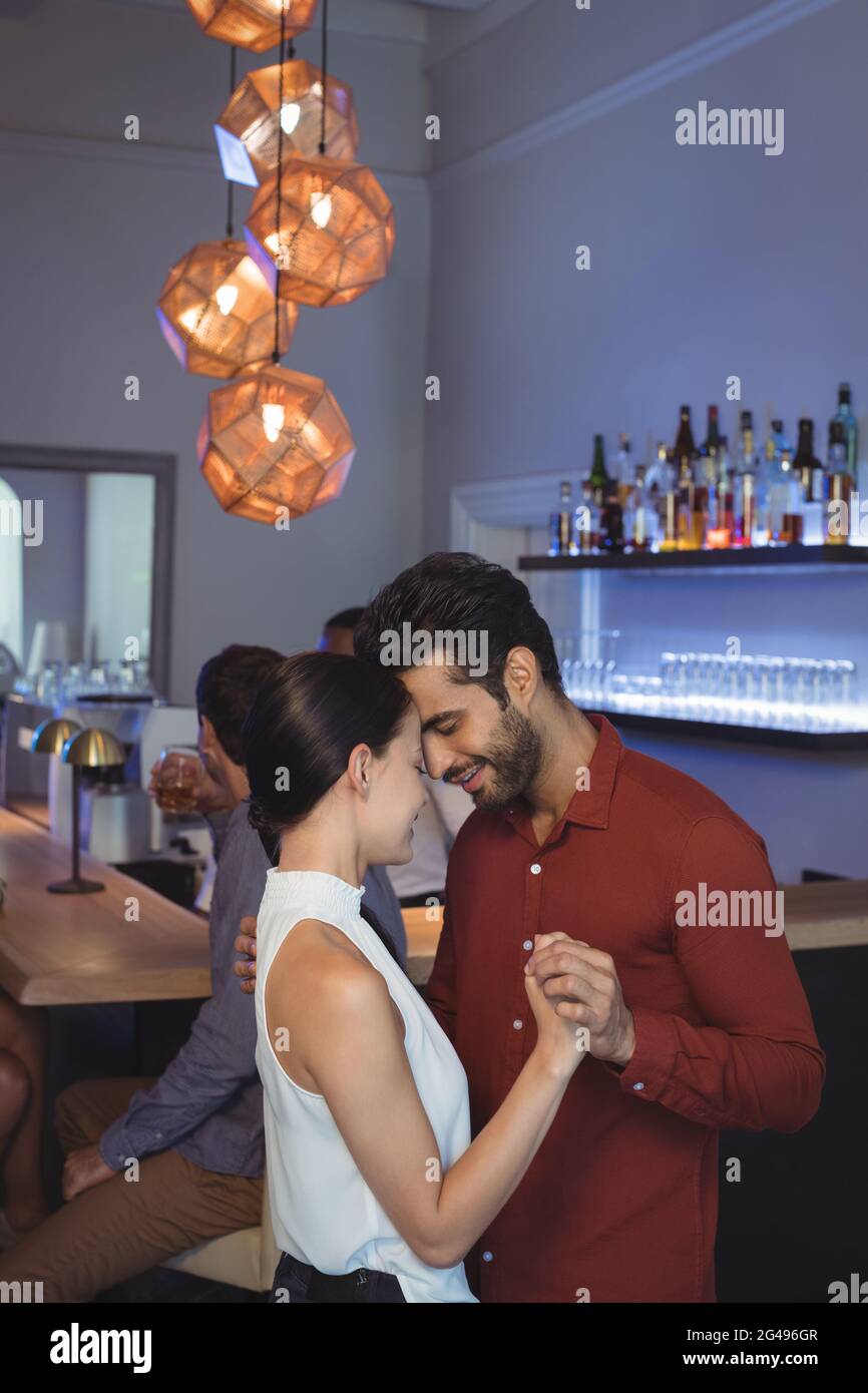 Elegant romantic couple dancing together hi-res stock photography and ...