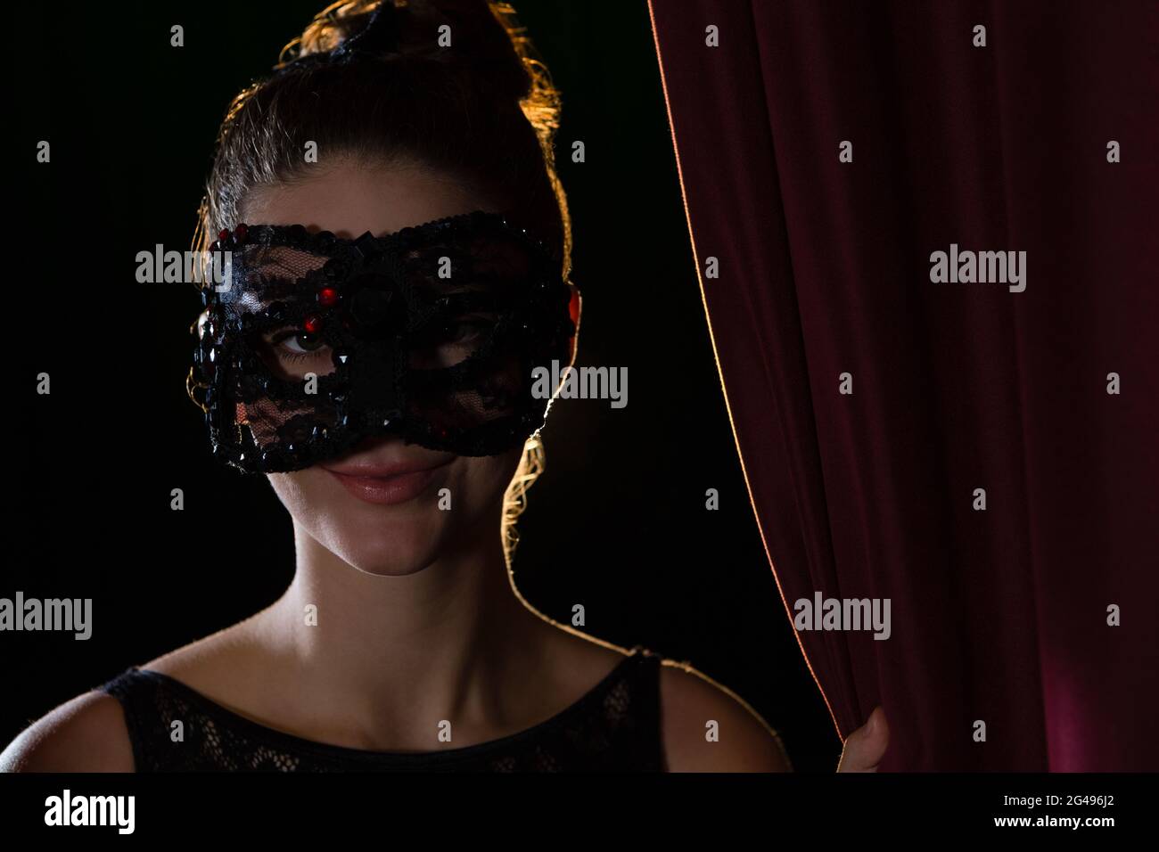 Wearing masquerade mask hi-res stock photography and images - Alamy