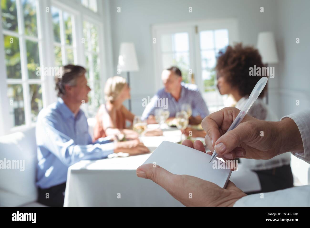 Waitress writing order hi-res stock photography and images - Alamy